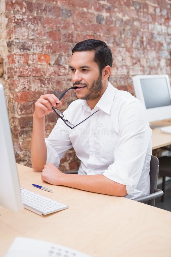 Businessman Using Computer at Desk Stock Image - Image of happy ...