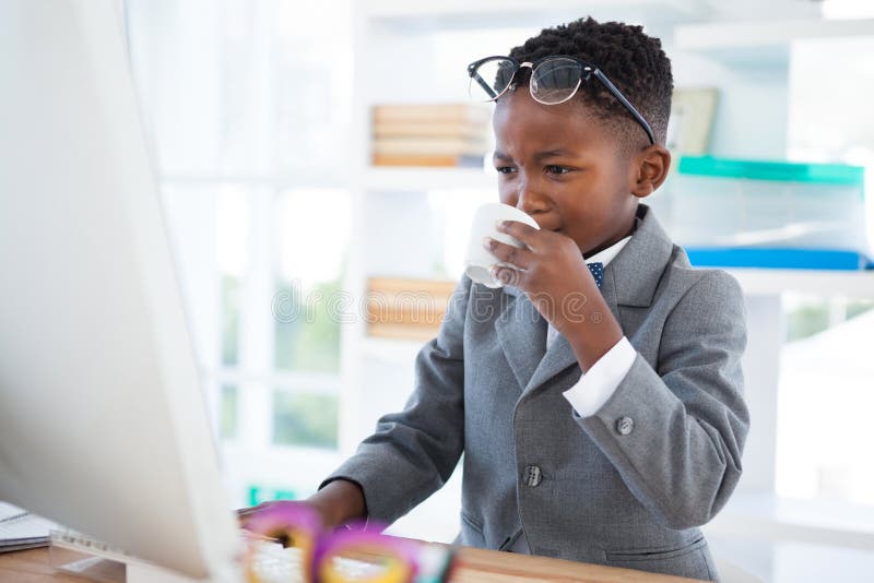 Businessman Using Computer while Drinking Coffee Stock Image - Image of ...