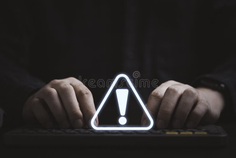 Businessman Using Computer Laptop with Triangle Caution Warning Sign ...