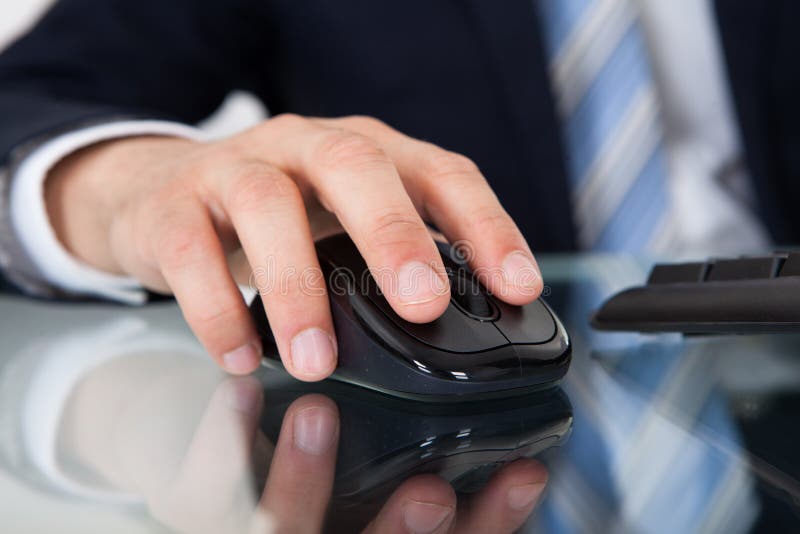Cropped Image of Businesswoman Using Mouse on Desk at Office Stock ...