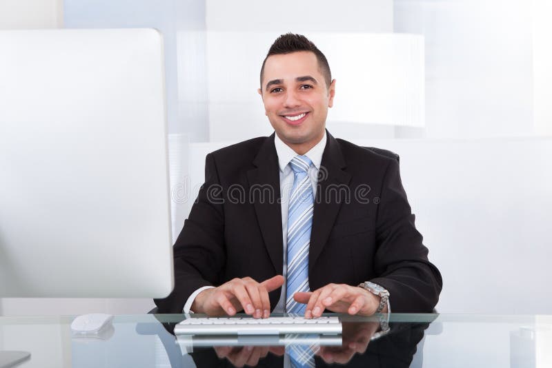 Businessman Using Computer in Office Stock Image - Image of looking ...