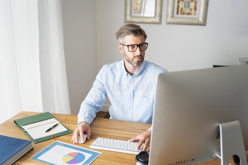 Businessman Using Computer while Working from Home Stock Image - Image ...