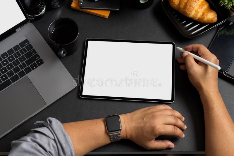 Businessman Using Digital Tablet Computer at His Office Desk Stock ...