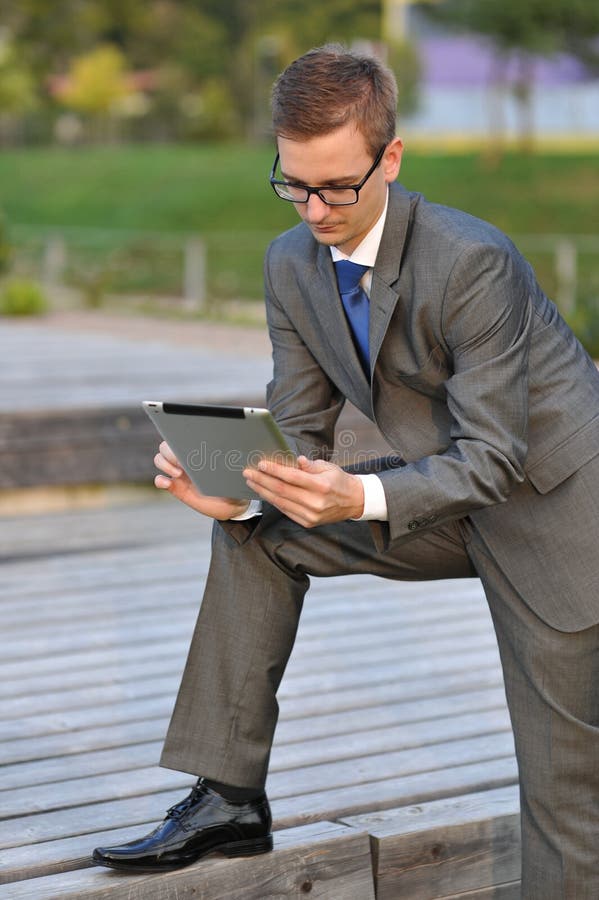 Businessman Using Electronic Tablet Outside Stock Image - Image of ...