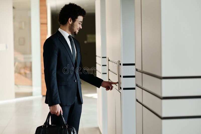 Businessman Using Elevator in Office Building Stock Image - Image of ...