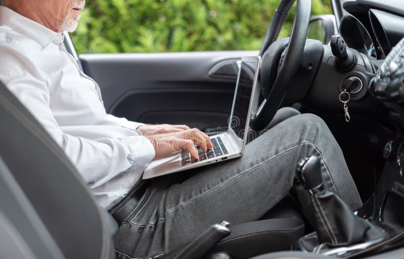 Businessman Using His Laptop in Car Stock Photo - Image of caucasian ...