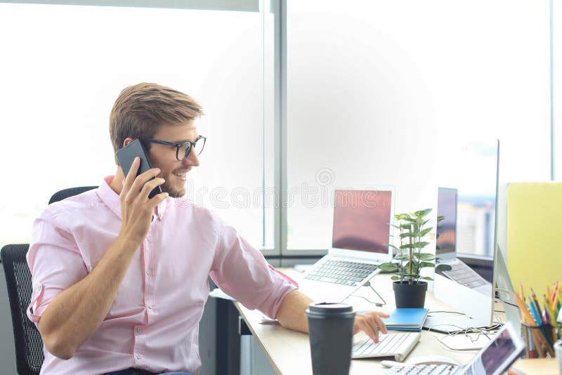Businessman Using His Mobile Phone in the Office Stock Photo - Image of ...