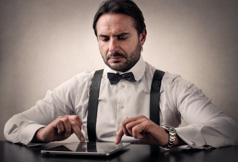 Businessman using an ipad stock image. Image of male - 67495547