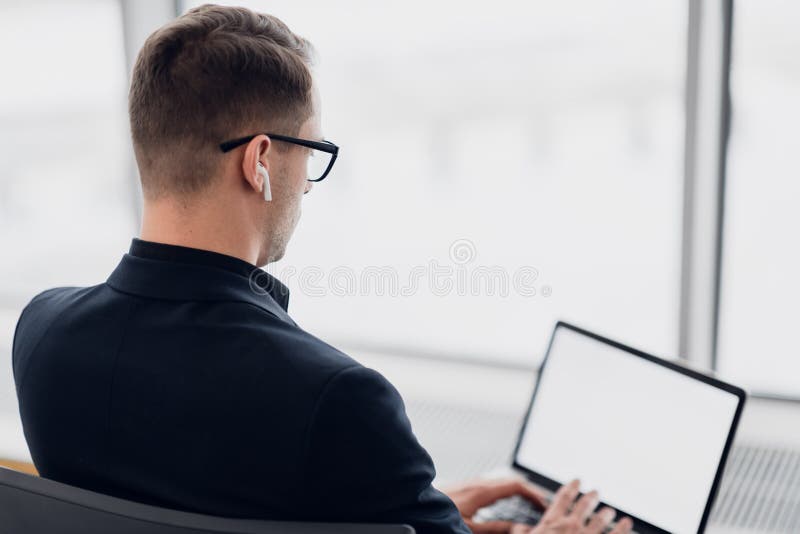 Businessman Using Laptop with Blank Screen at Public Place Stock Photo ...