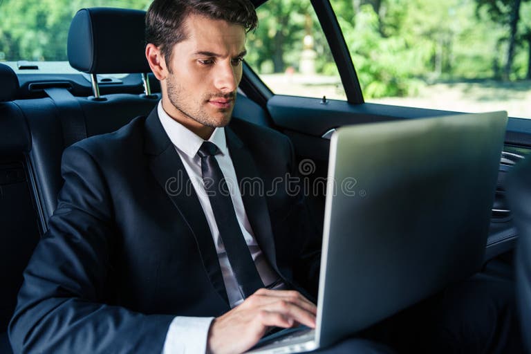Businessman Using Laptop in Car Stock Image - Image of caucasian ...