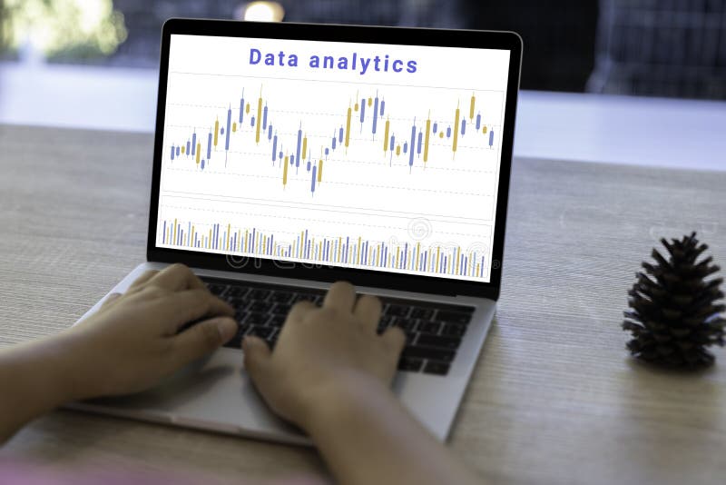 Businessman Using a Laptop Computer with Data Analytics and Statistics ...