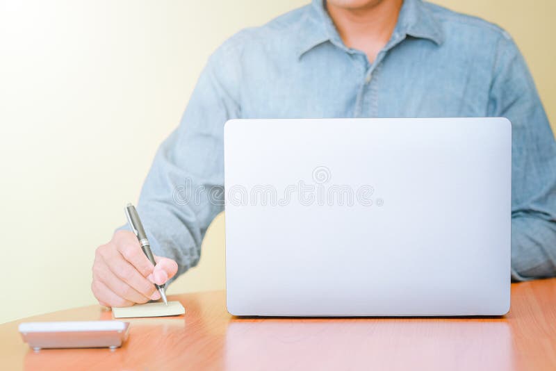 A Businessman Using a Laptop Computer To Search for Information and ...