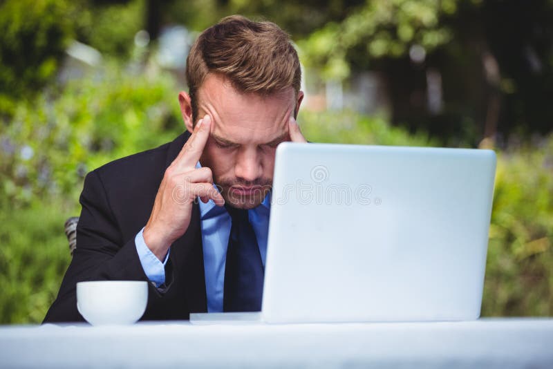 Businessman Using Laptop Having a Headache Stock Photo - Image of ...