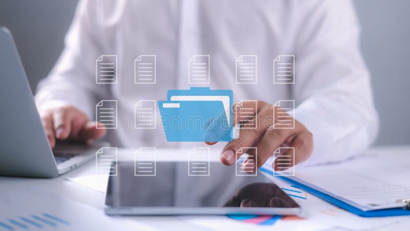 Businessman Using Laptop with Holographic Interface To Access Files, Showcasing Cloud Computing ...