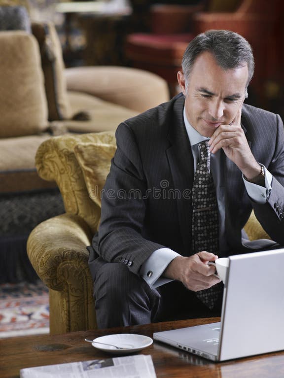 Businessman Using Laptop stock photo. Image of boomer - 33911308