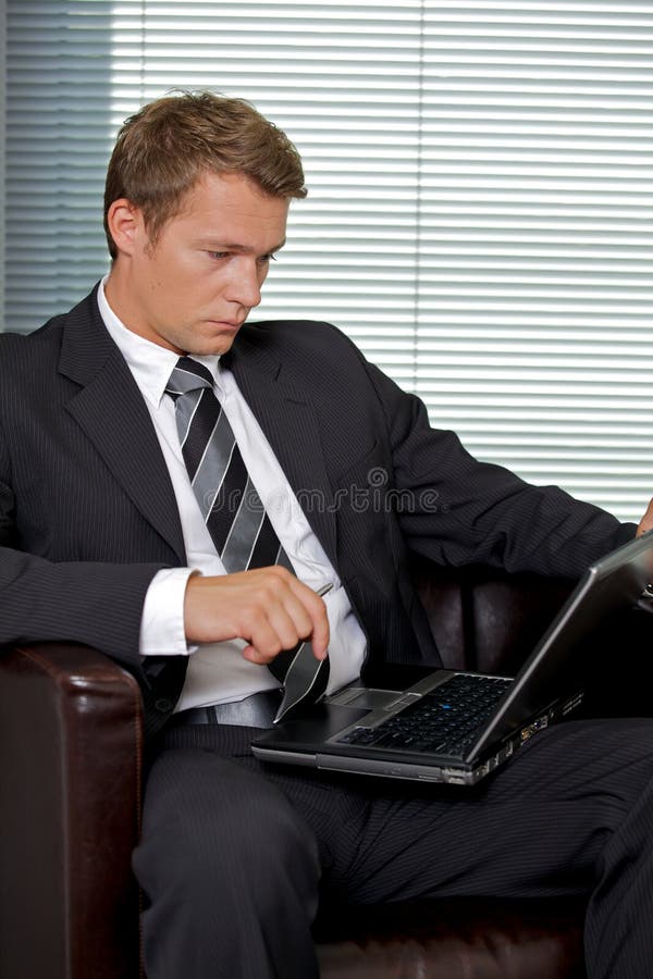 Businessman Using Laptop in Office Stock Photo - Image of businessman ...