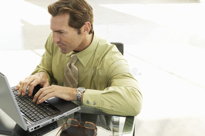 Businessman Using Laptop in Office Stock Photo - Image of smart, laptop ...