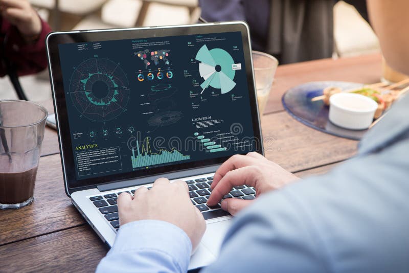 Businessman Using Laptop with Project Statistics Data, Analyzing ... Businessman Using Laptop with Project Statistics Data, Analyzing ...