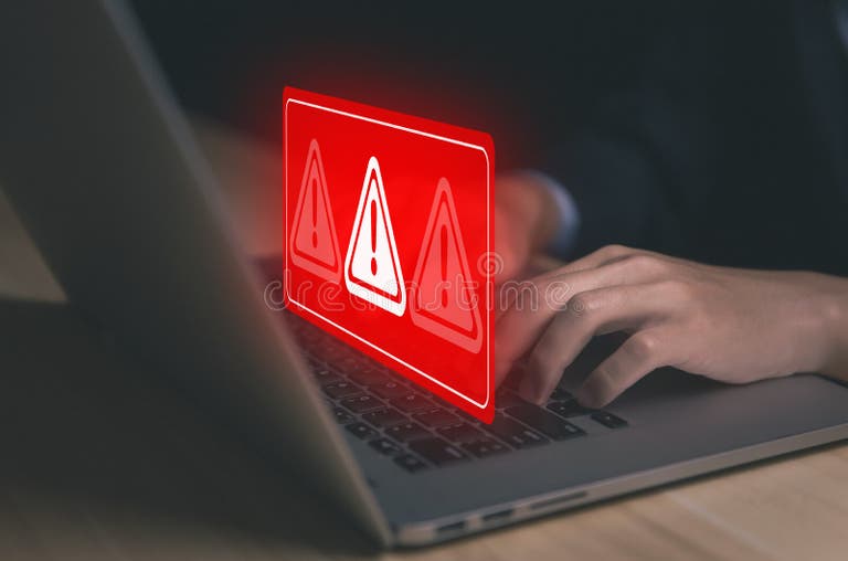 Businessman Using Laptop Showing Warning Triangle and Exclamation Sign ...