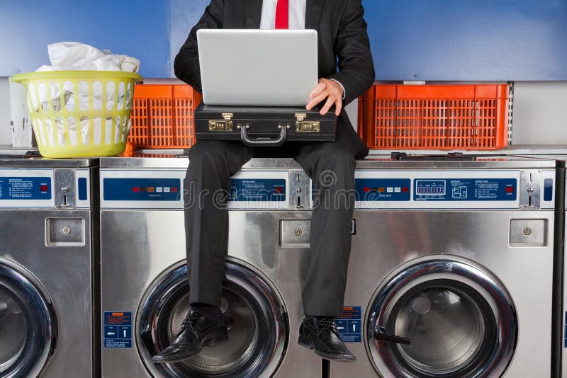 Businessman Using Laptop while Sitting on Washing Stock Photo - Image ...