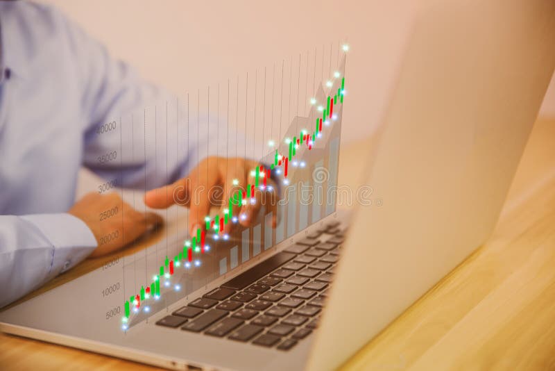 Businessman Using a Laptop To Plan a Strategy that Shows a Positive ...