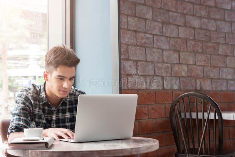 Businessman Using Laptop on Wooden Table Stock Photo - Image of display ...