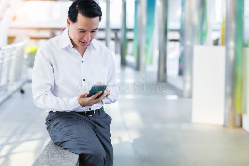 Businessman Using Mobile Phone by Chatting with Team Attractive Guy ...