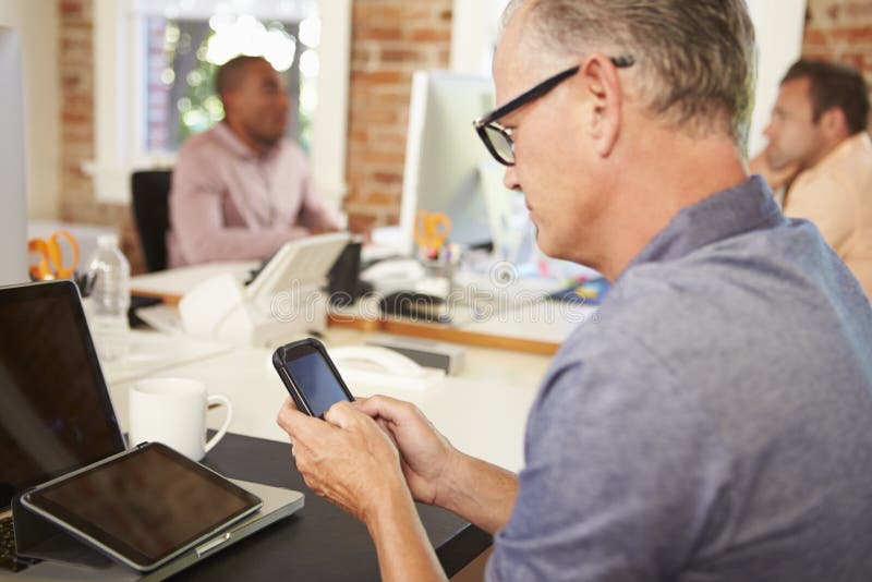 Two Men Using Tablet Computer in Creative Office Stock Image - Image of ...