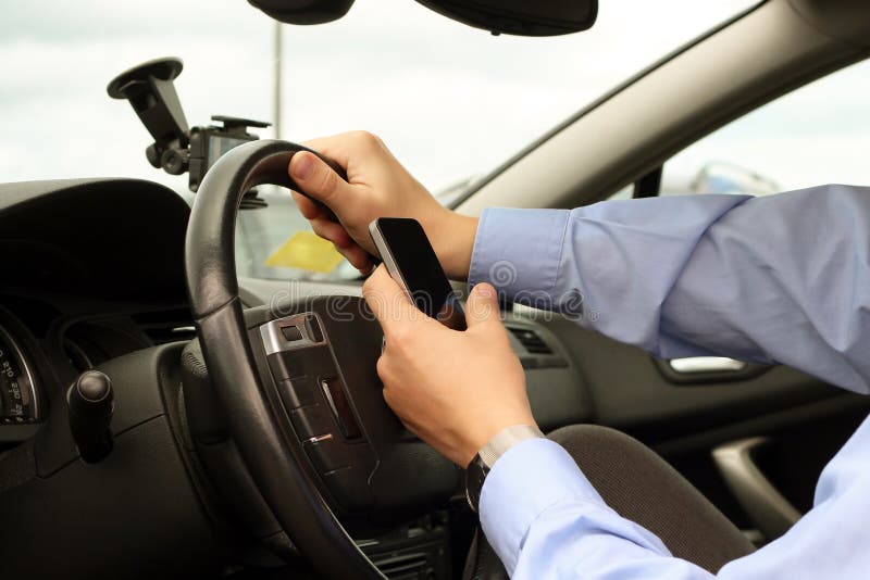 Businessman Using Mobile Phone while Driving the Car Stock Image ...
