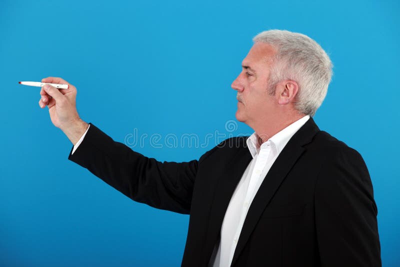 Businessman using a pen stock photo. Image of holds, focus - 31131948