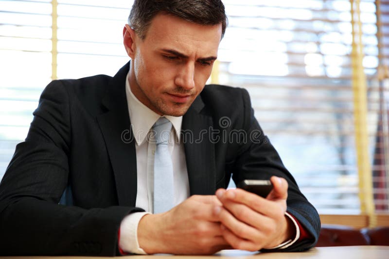 Businessman Using Smartphone at Office Stock Image - Image of sofa ...