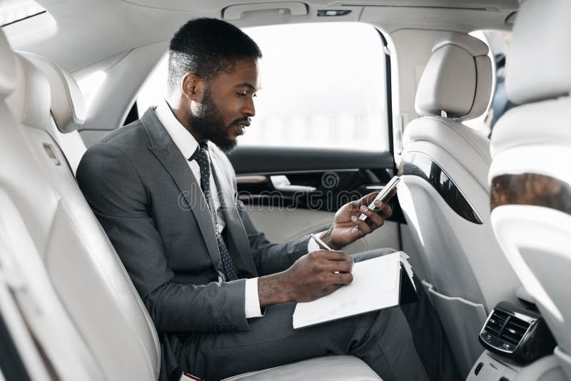 Businessman Using Smartphone Taking Notes Making Schedule Sitting in ...