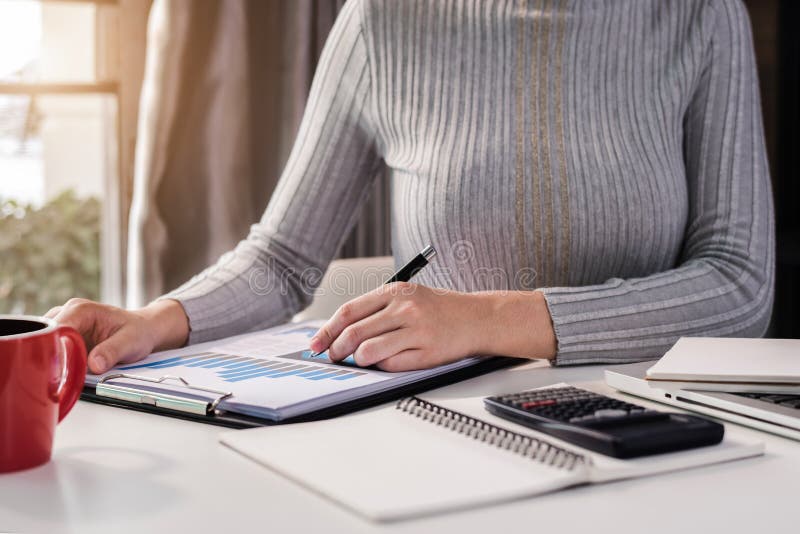 Businessman Using a Tablet and Computer To Analysis Graph Company ...