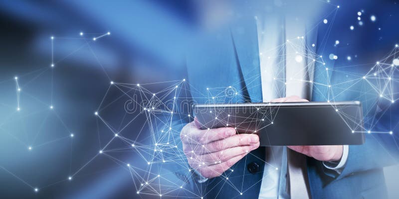 A Businessman Using a Tablet with Network Connection Graphics Overlay ...