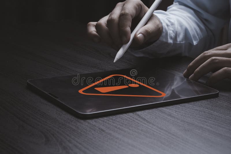 Businessman Using Tablet with Red Triangle Caution Warning Sign for ...