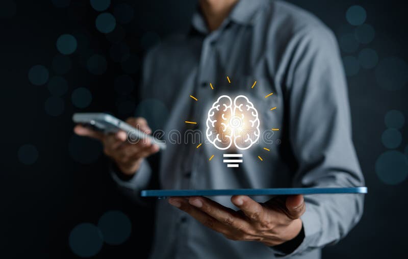 Businessman Using Tablet and Smartphone with Virtual Lightbulb with ...