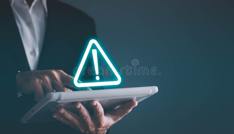 Businessman Using Tablet with Triangle Caution Warning Sing for ...