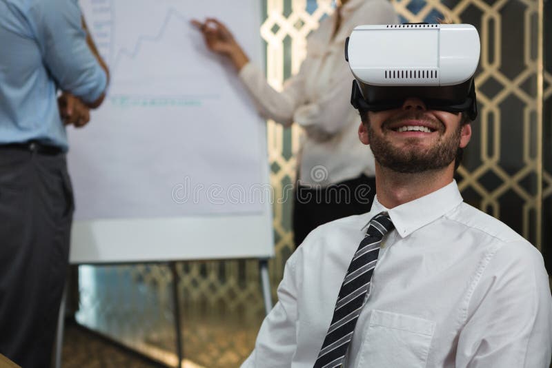 Businessman Using Virtual Reality Headset in Conference Room Stock ...