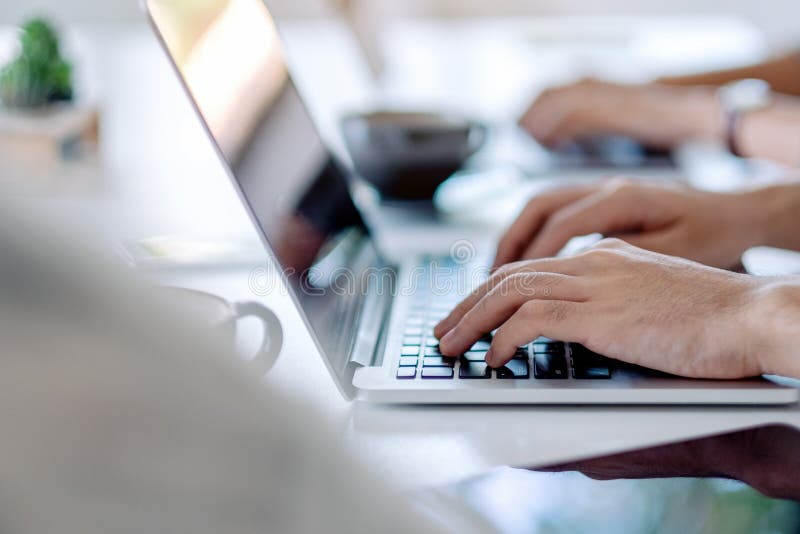 Businessman Using and Working on Laptop Computer Together Stock Photo ...