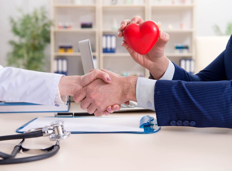 Businessman Visiting Cardiologist for Routine Check-up Stock Photo ...