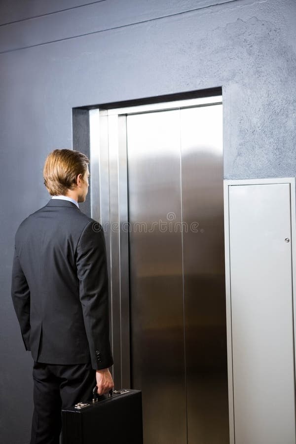 Businessman Waiting for Elevator Stock Image - Image of elevator ...