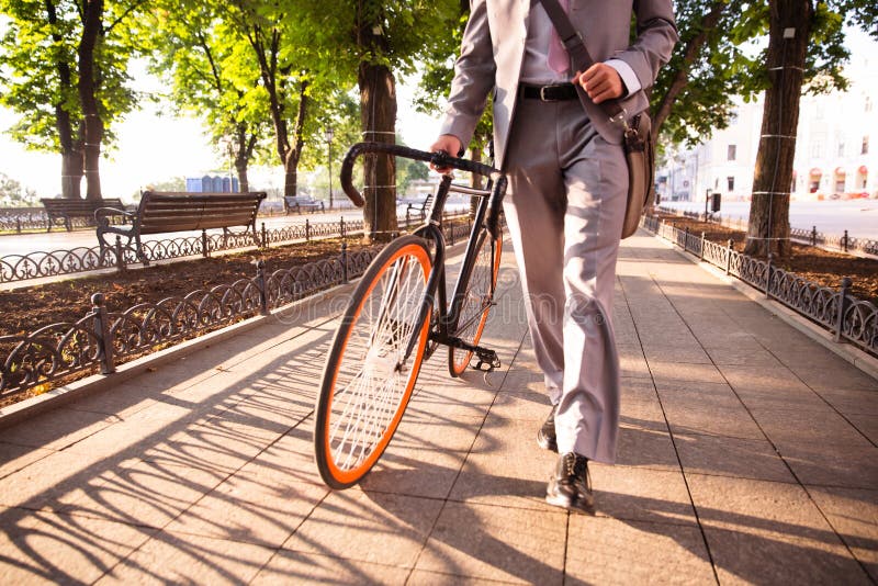 Businessman Walking with Bicycle Stock Photo - Image of suit, cheerful ...