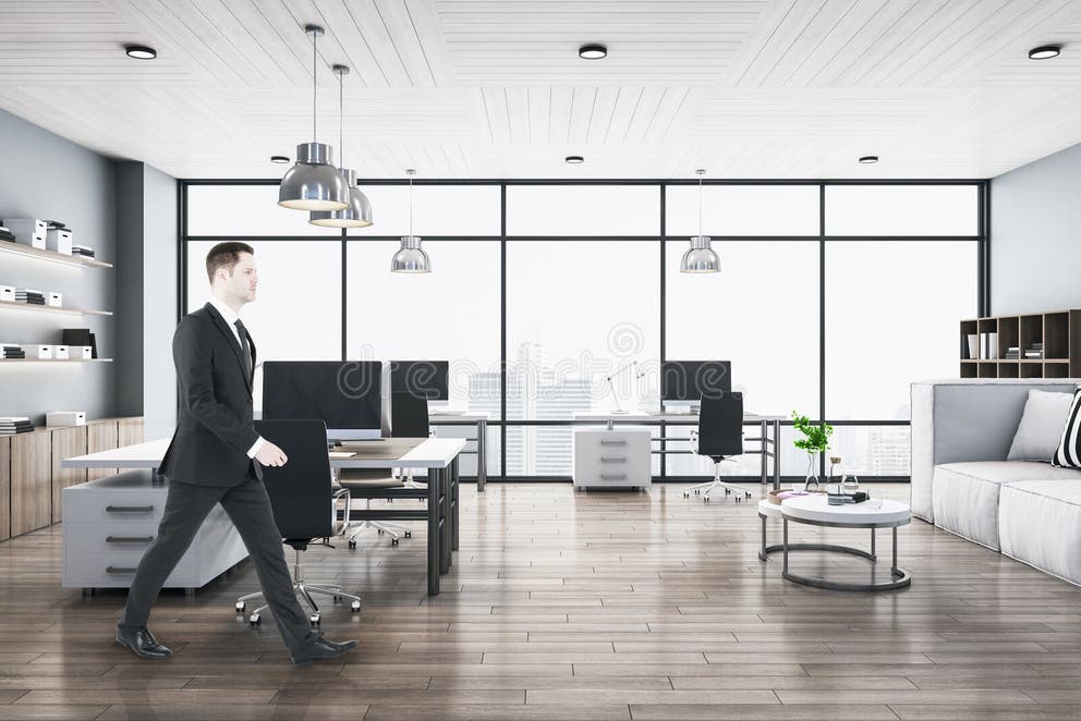 Businessman Walking in Modern Office Interior with Computers Stock ...