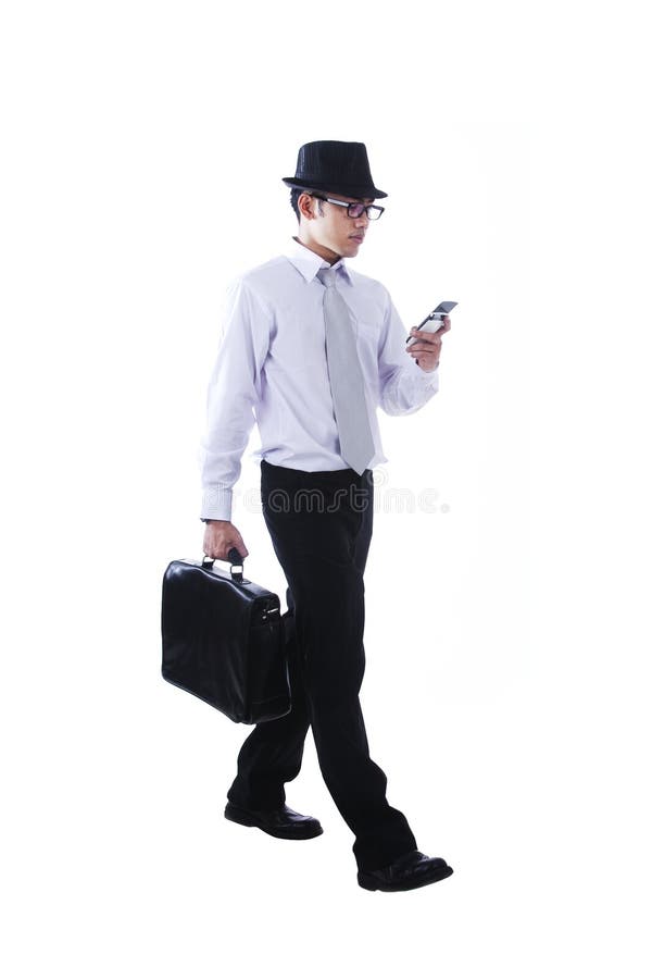 Businessman Walking while Using Mobile Phone Stock Photo - Image of ...