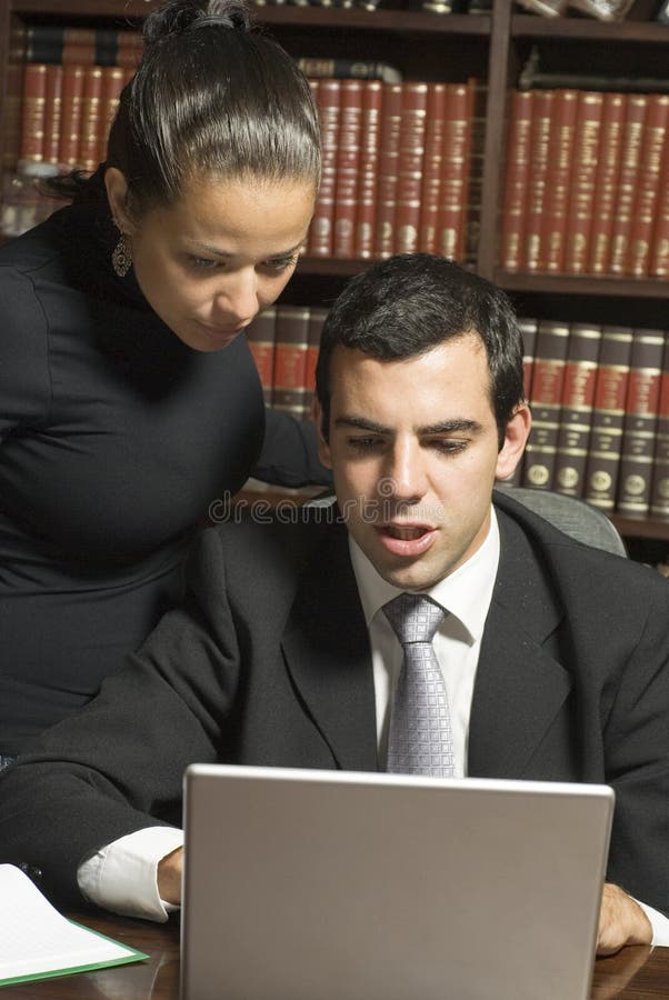 Businessman and Woman Look at Computer - Vertical Stock Photo - Image ...