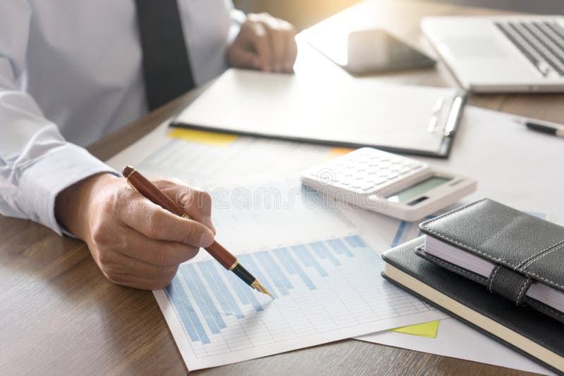 Businessman Work With Computer On Table In Office Work With Paper Graph ...