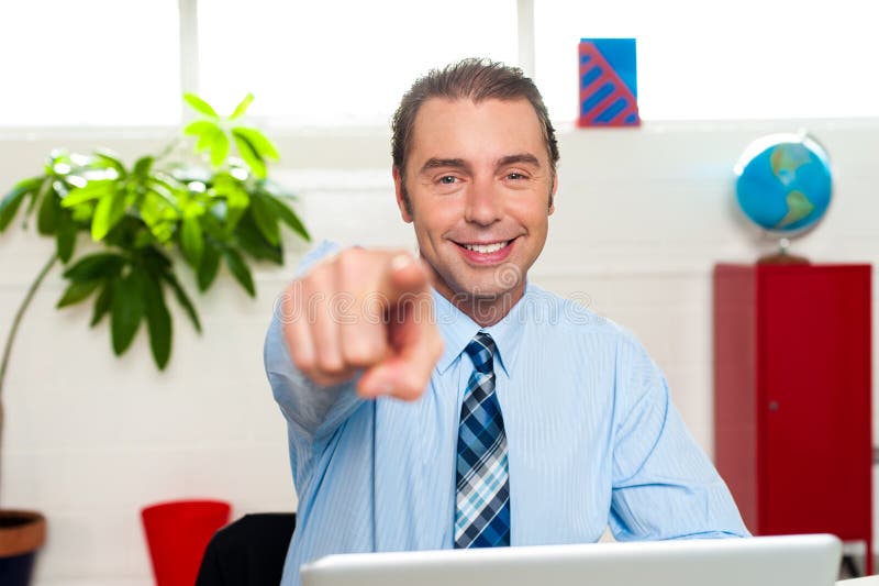 Businessman at Work Desk Pointing at You Stock Photo - Image of ...