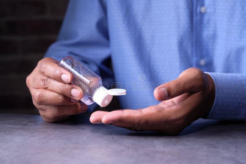Businessman Work in Office Room Using Hand Sanitizer. Stock Photo ...