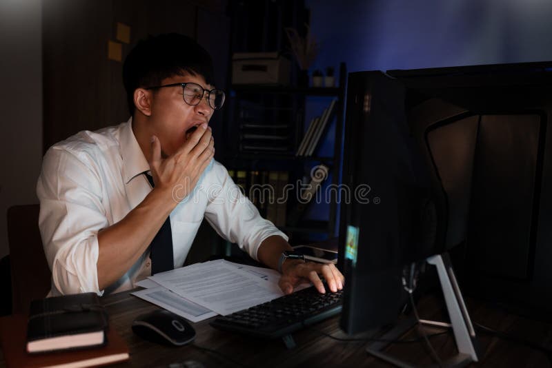 Businessman Workaholic Sit at the Computer Working Late at Night Yawn ...