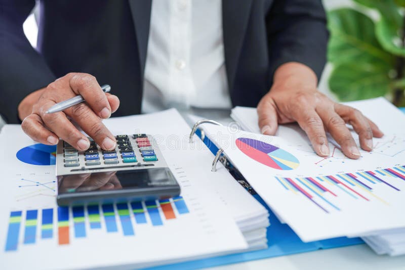 Businessman Working and Analysis with Statistic Graph in Office Stock ...